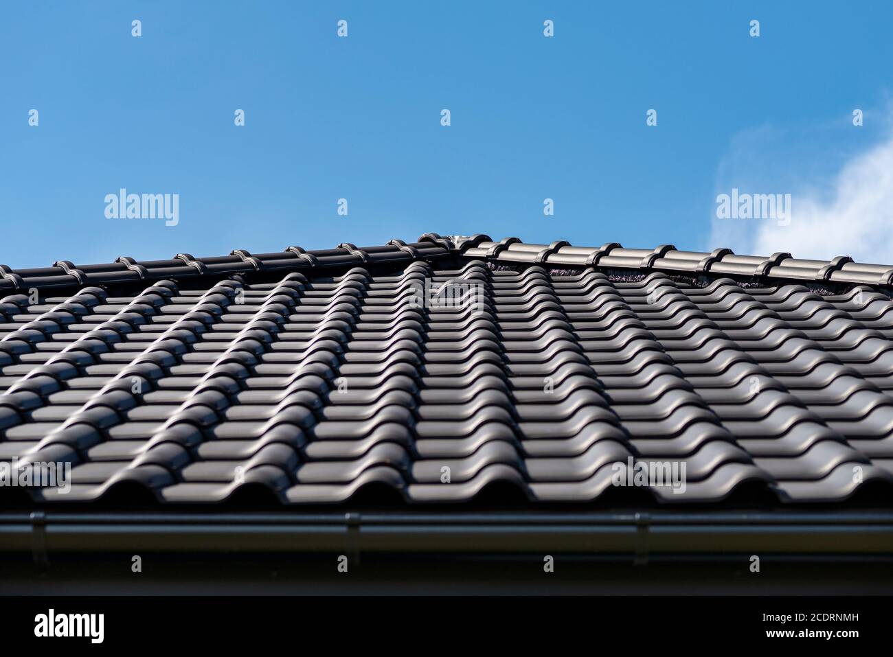 The roof of a single-family house covered with a new ceramic tile in ...