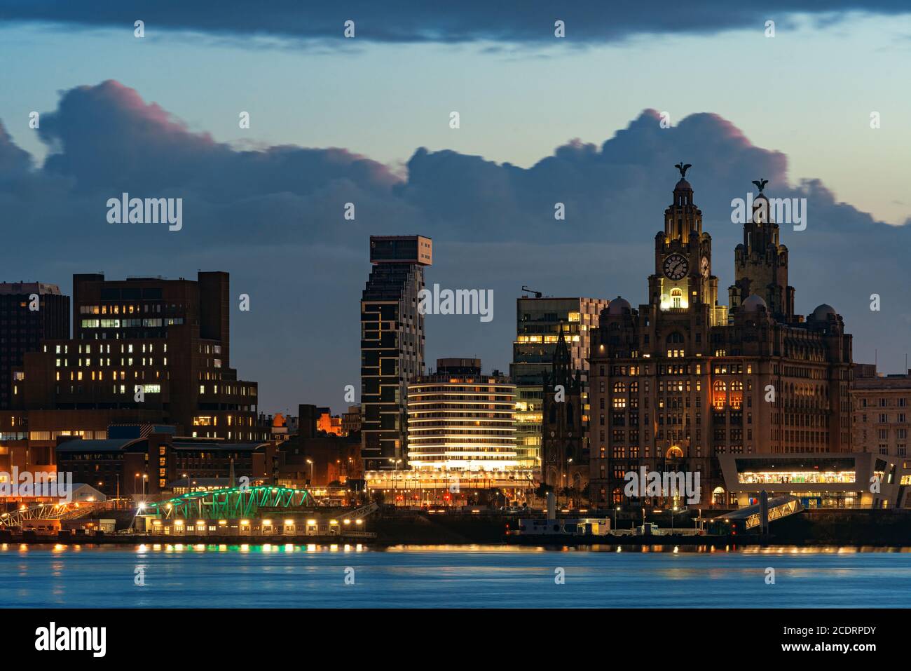 Liverpool Royal Liver Building at night with buildings in England in ...