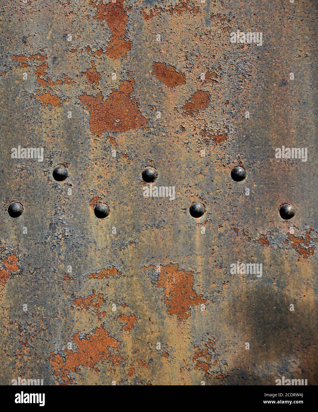 Weathered, rusted metal with rivets and peeling paint Stock Photo - Alamy