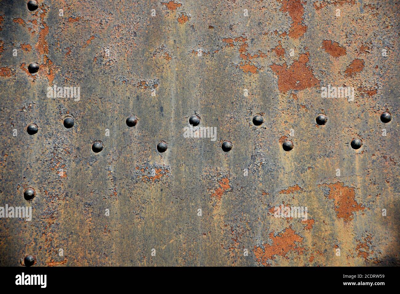Weathered, rusted metal with rivets and peeling paint Stock Photo - Alamy
