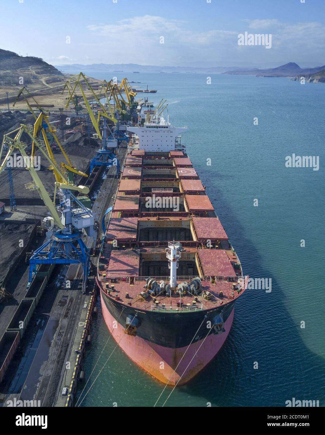 Vessel under loading in vostochny port, Russia Stock Photo - Alamy