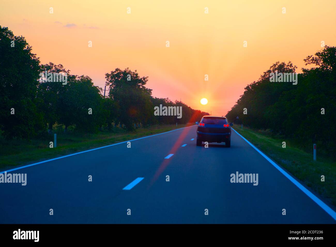 Driving to the dawn . Journey with sunrise . Sundial Over the Highway ...