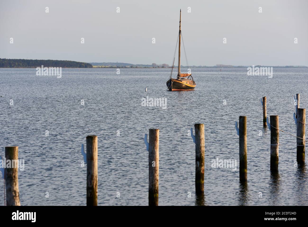 Anchored Saling Boat Stock Photo - Alamy