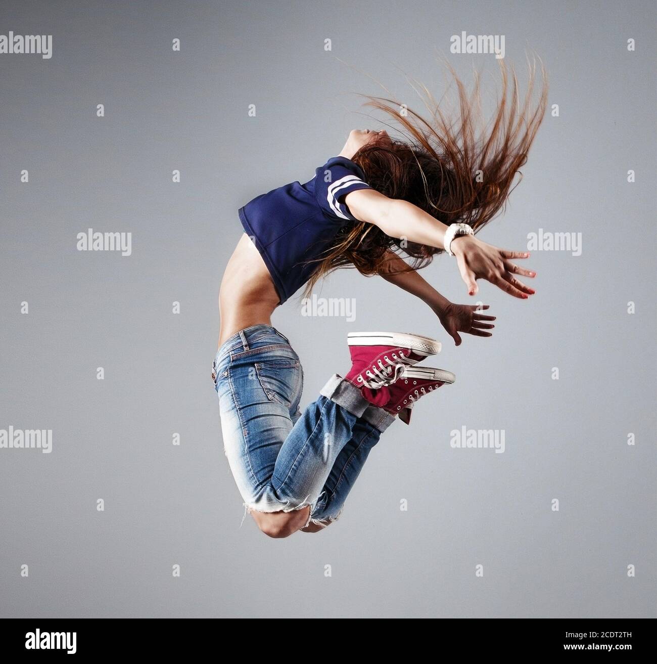 modern young beautiful dancer posing on a studio background Stock Photo ...