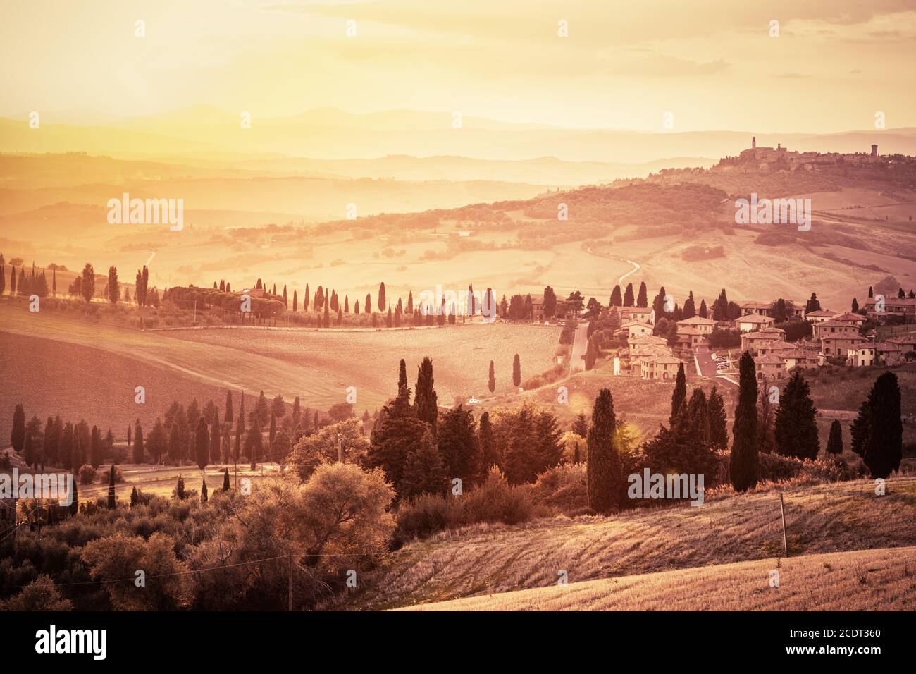 Wonderful Tuscany landscape with cypress trees, farms and small ...