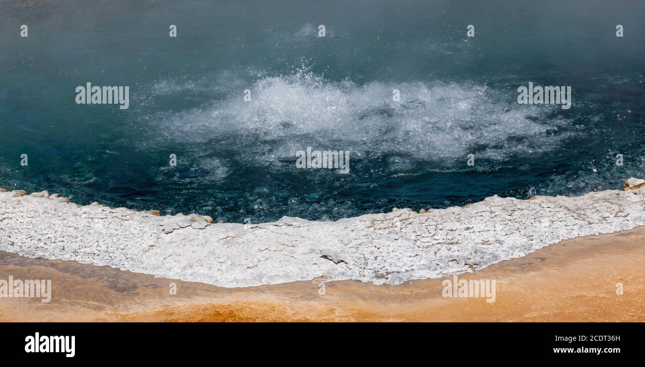 Deep blue boiling water inside of Crested Pool with a white rim at ...