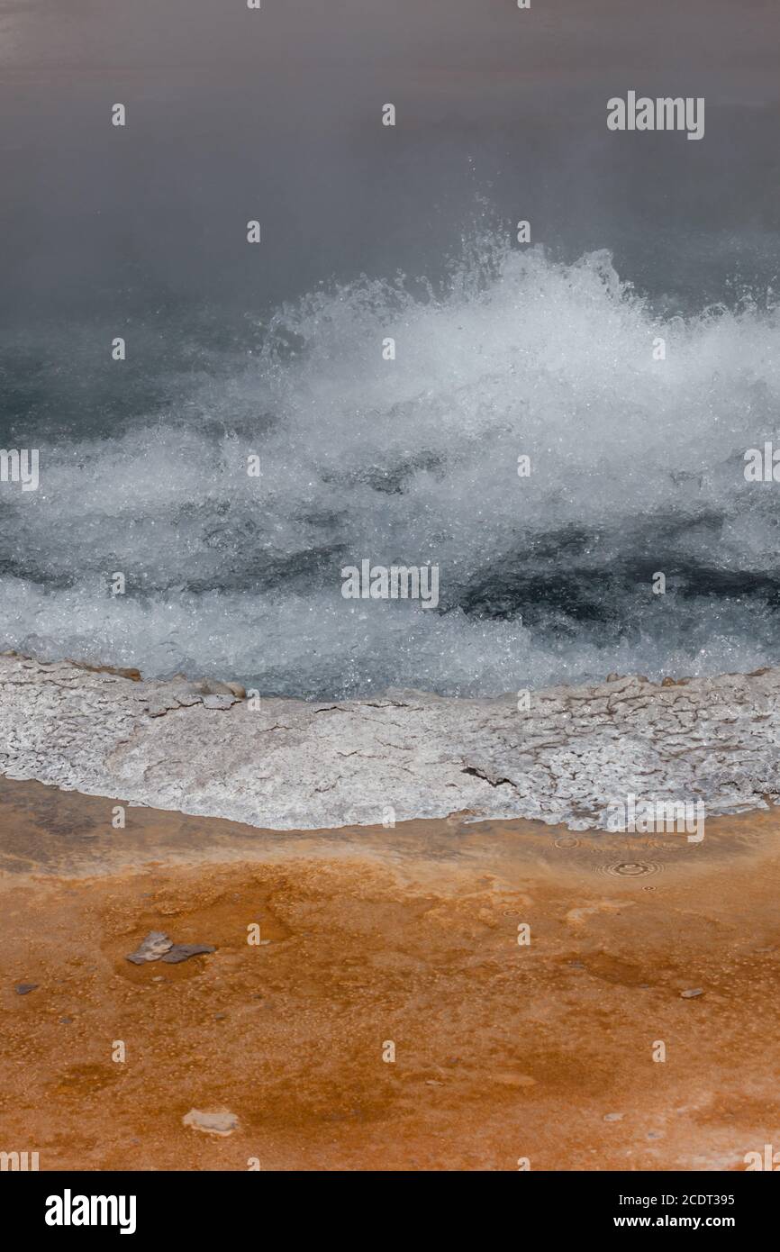Deep blue boiling water inside of Crested Pool with a white rim at ...