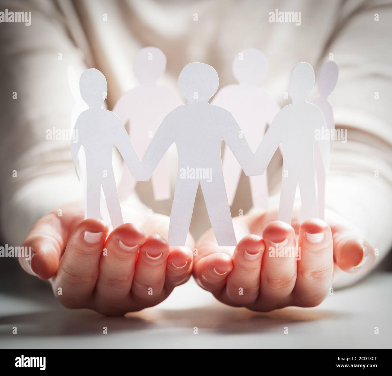 Paper people in hands in gesture of giving, presenting. Concept Stock ...