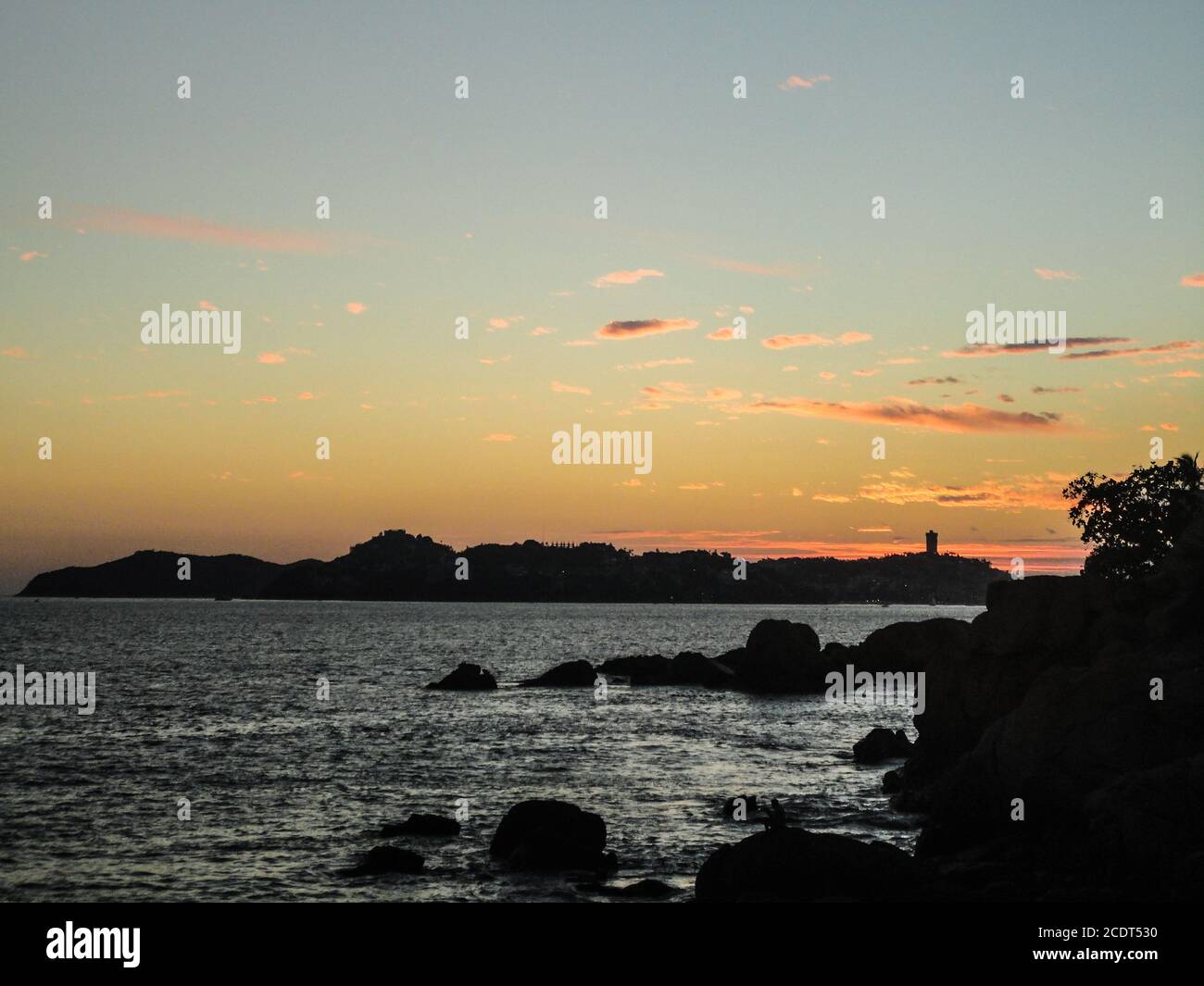 Sunset in Acapulco beaches in Mexico Stock Photo - Alamy