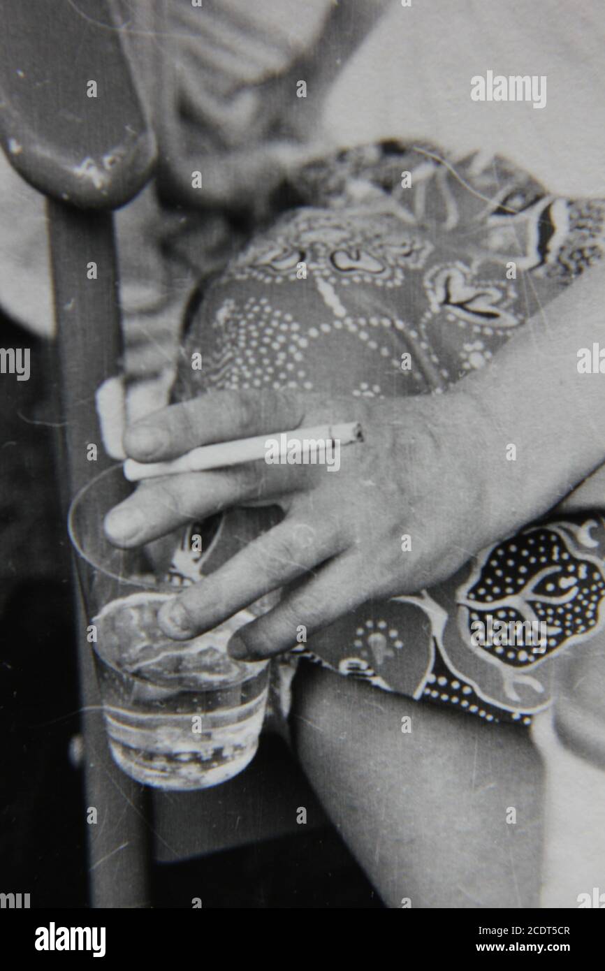Fine 1970s vintage black and white photography of a woman smoking a ...