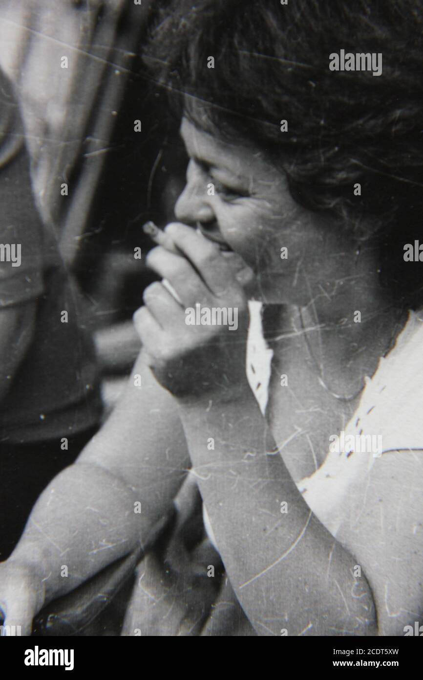 Fine 1970s vintage black and white photography of a woman smoking a ...