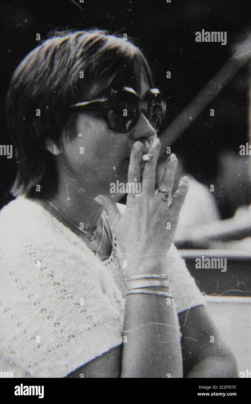 1970s woman smoking cigarette hi-res stock photography and images - Alamy