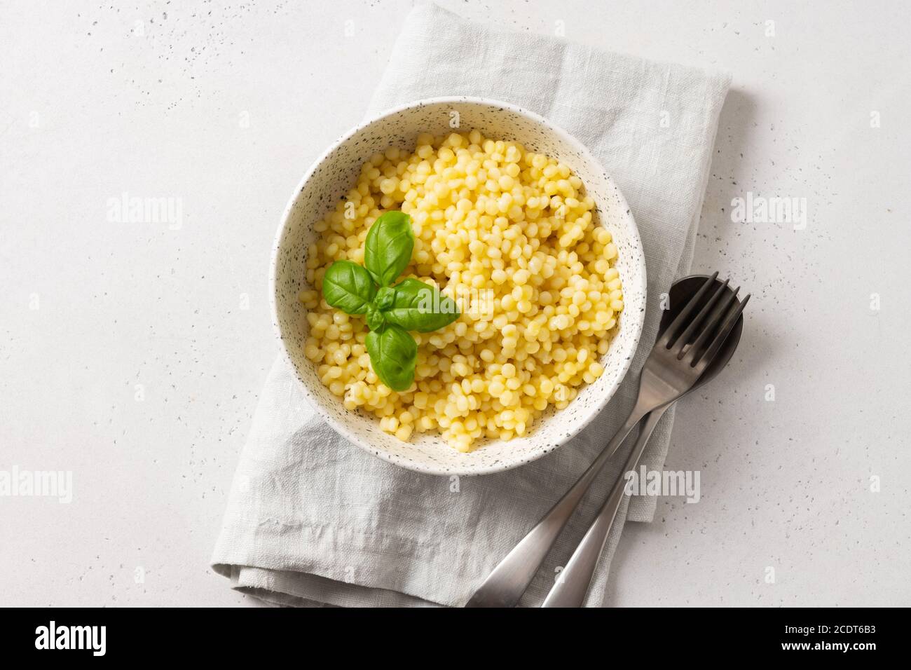Homemade pasta ptitim on white. Top view Stock Photo - Alamy
