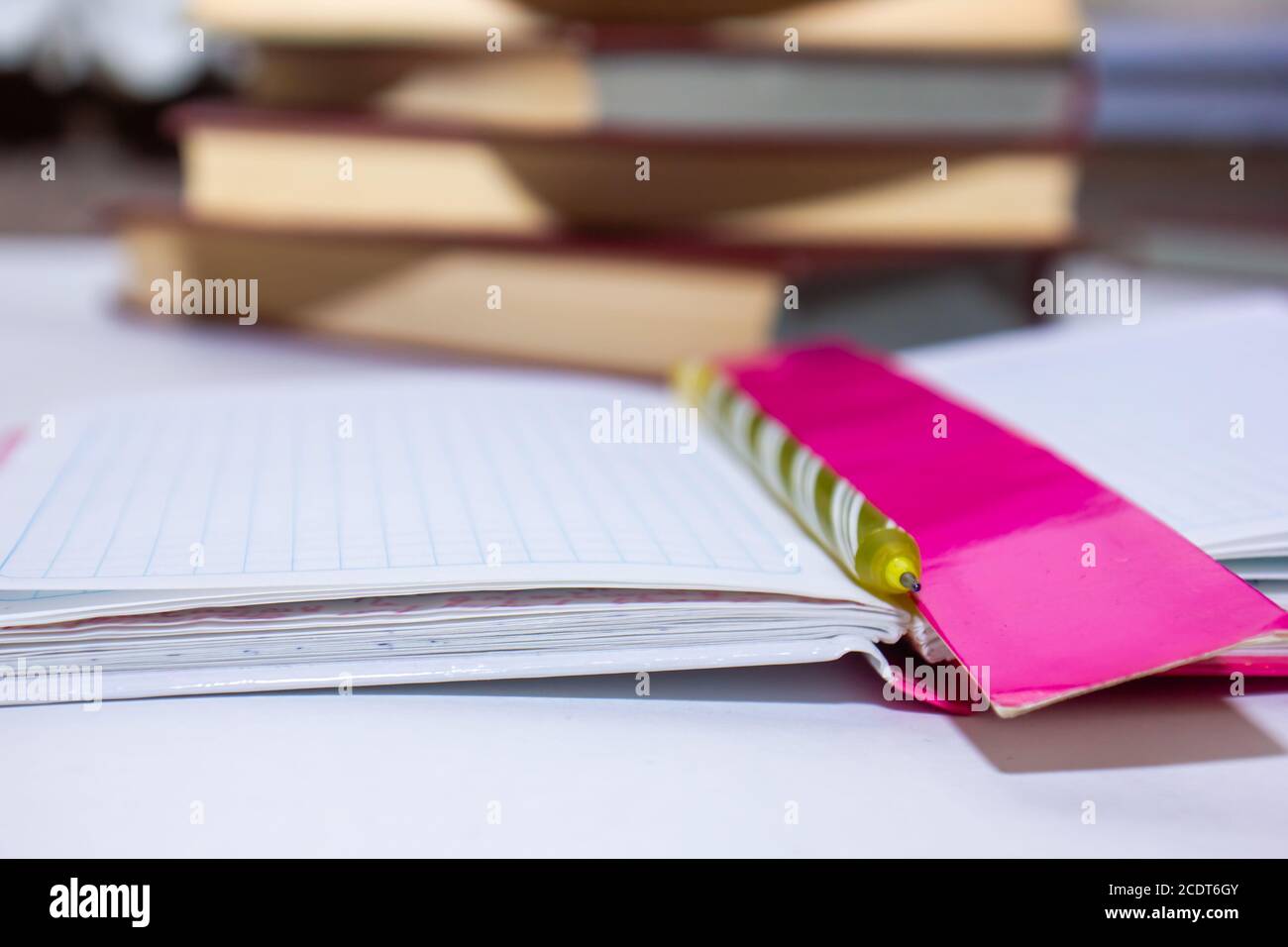 stack of books on a white background, notebook and pen Stock Photo - Alamy