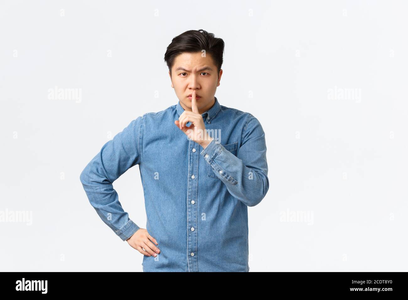 Angry asian man, teacher shushing at disobedient student, looking ...