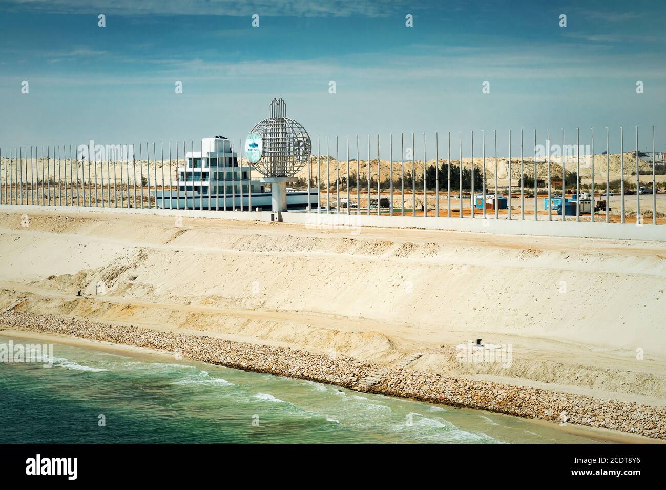 Section of the new Suez expansion canal with the Suez Canal monument ...
