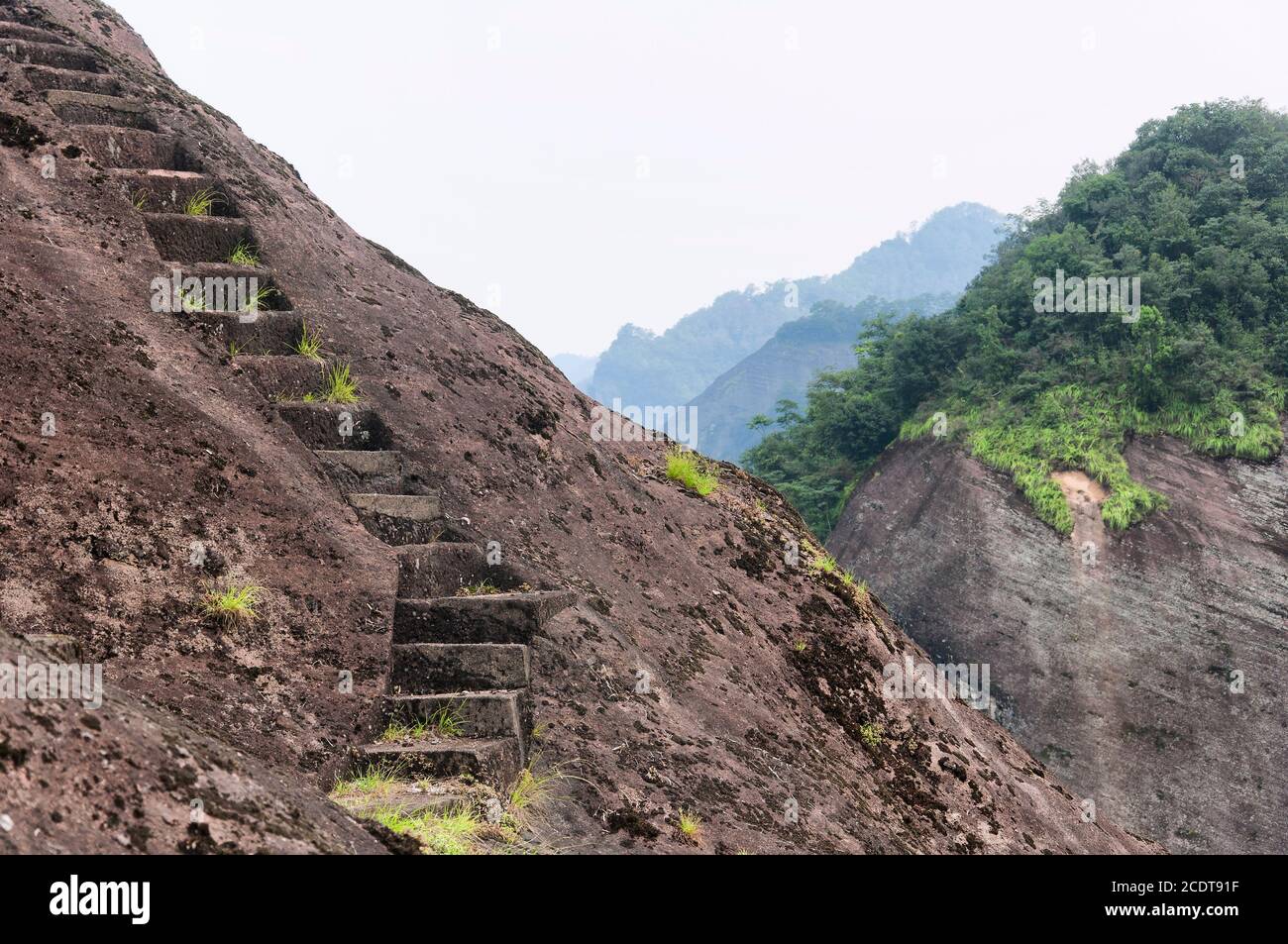 Steps leading up tianyou peak at wuyishan on an overcast day in Nanping ...