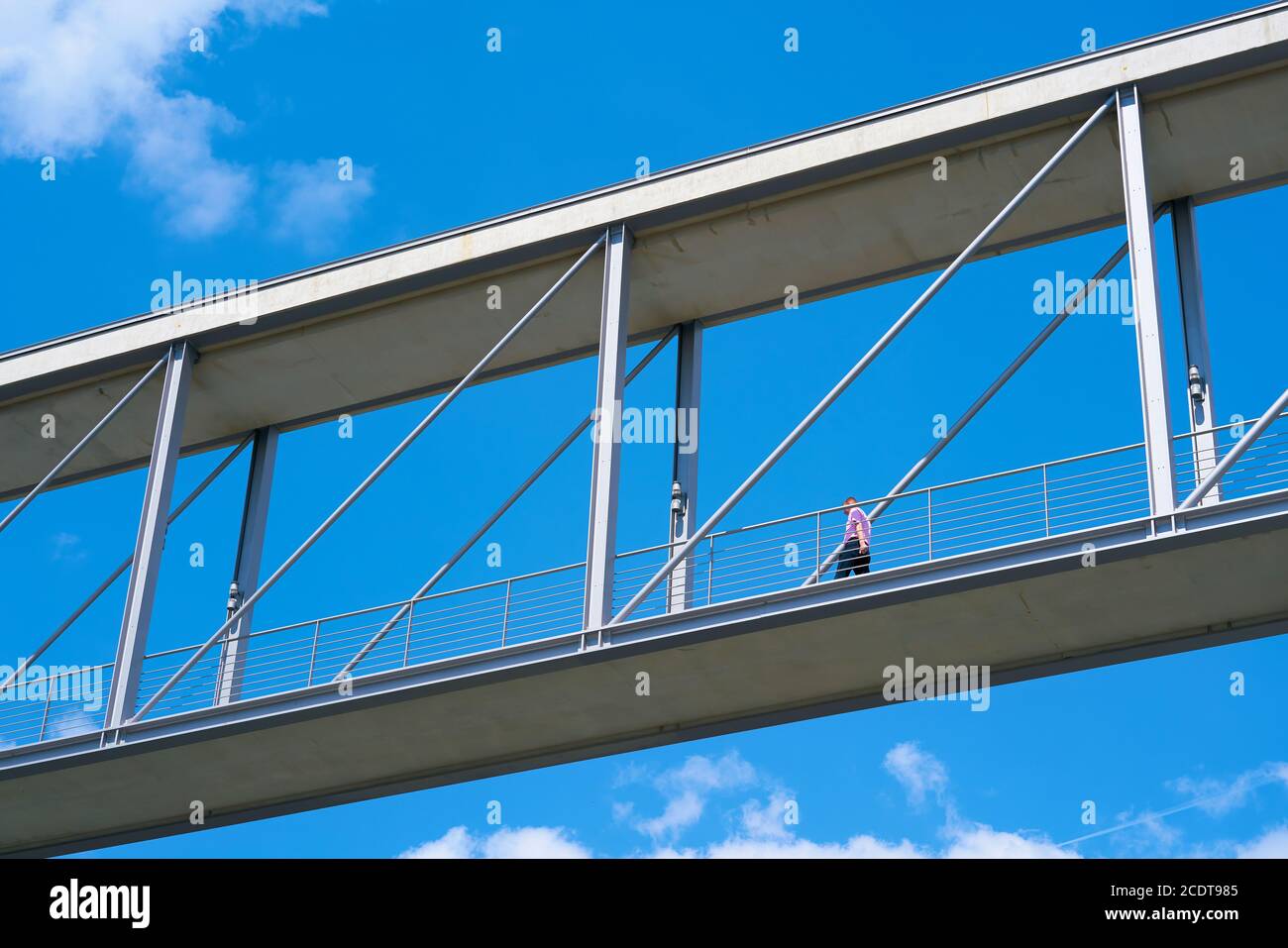 Man on a bridge between two government buildings in the government ...