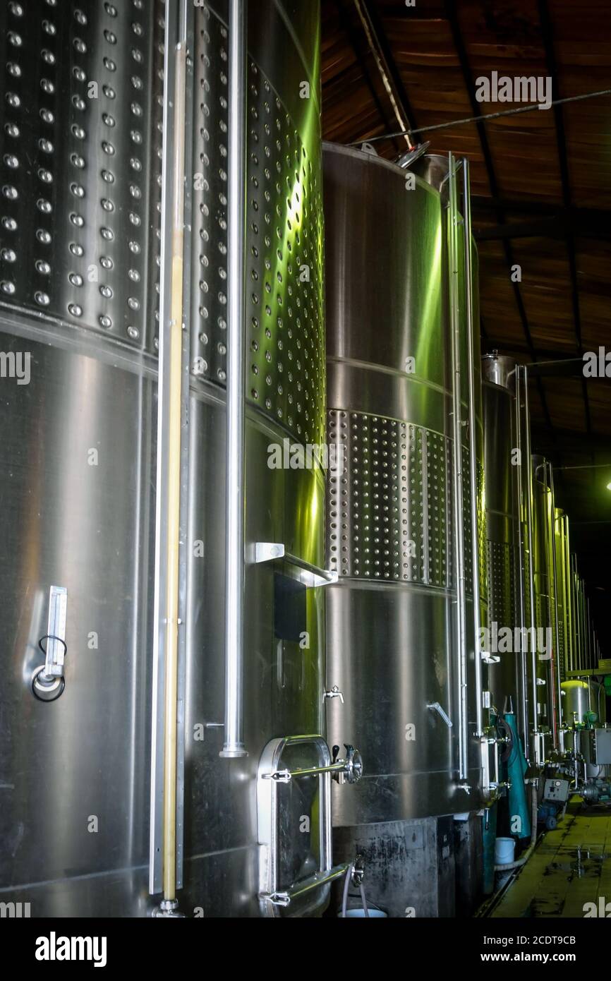 metal wine barrels in a winery Stock Photo - Alamy