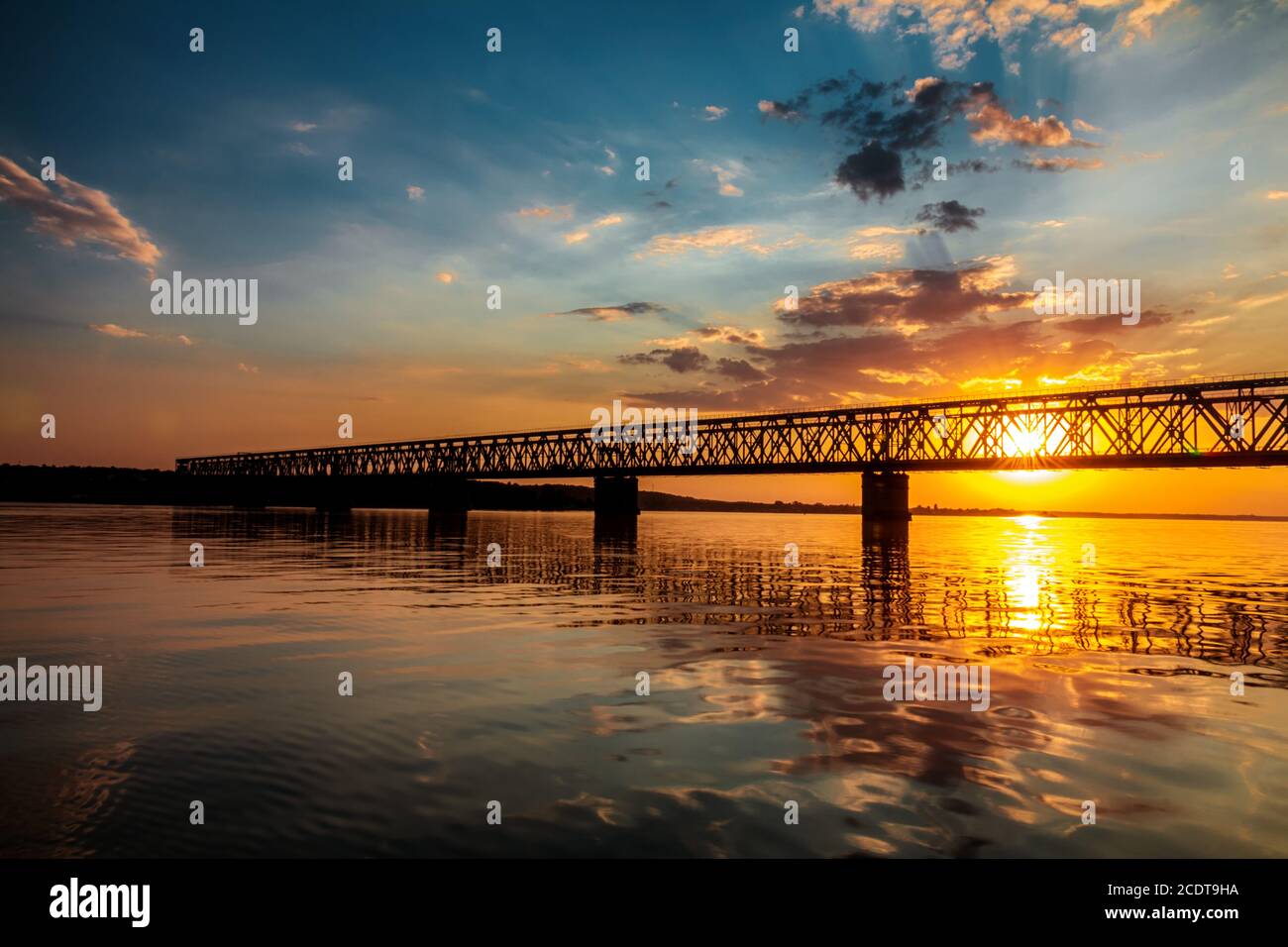 Stunning sunset colors over river with bridge in a summer evening Stock ...
