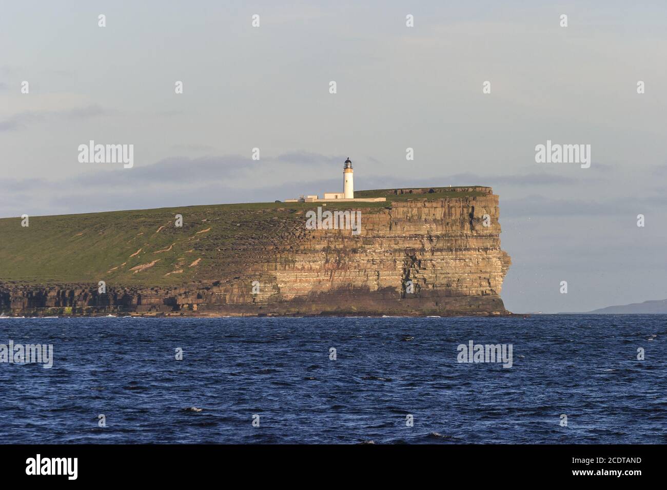 Lighthouse on a high cliff Stock Photo - Alamy