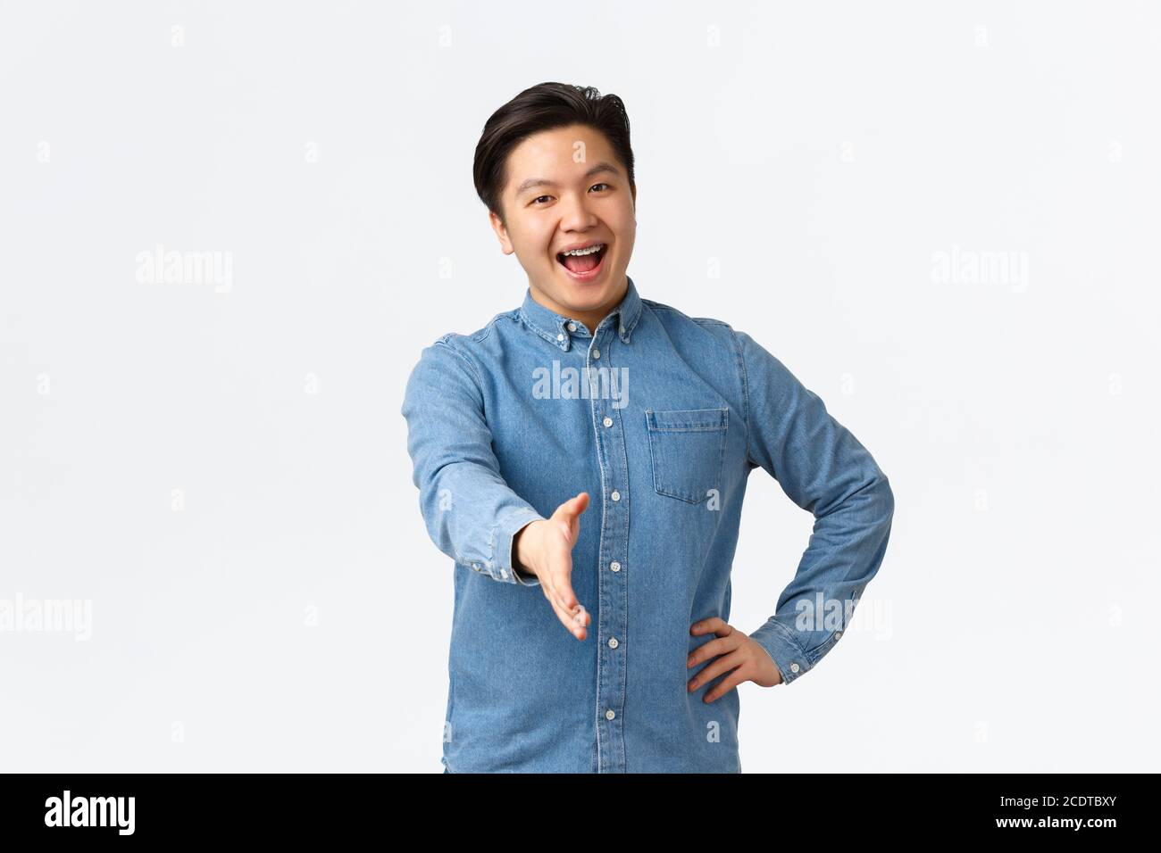 Friendly happy smiling asian man with braces saying nice to meet you ...