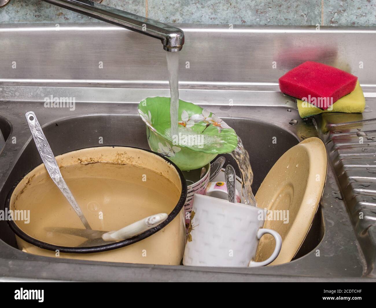 Dirty Dishes Pile High Resolution Stock Photography and Images - Alamy