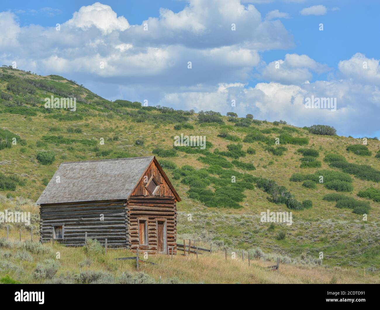 Old log cabin, abandoned in the country hillside of Rocky Mountains in ...