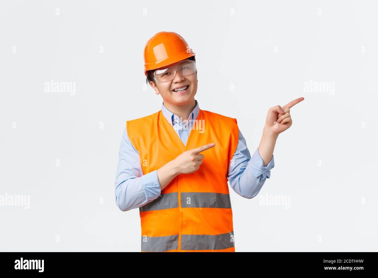 Building sector and industrial workers concept. Cheerful smiling asian ...