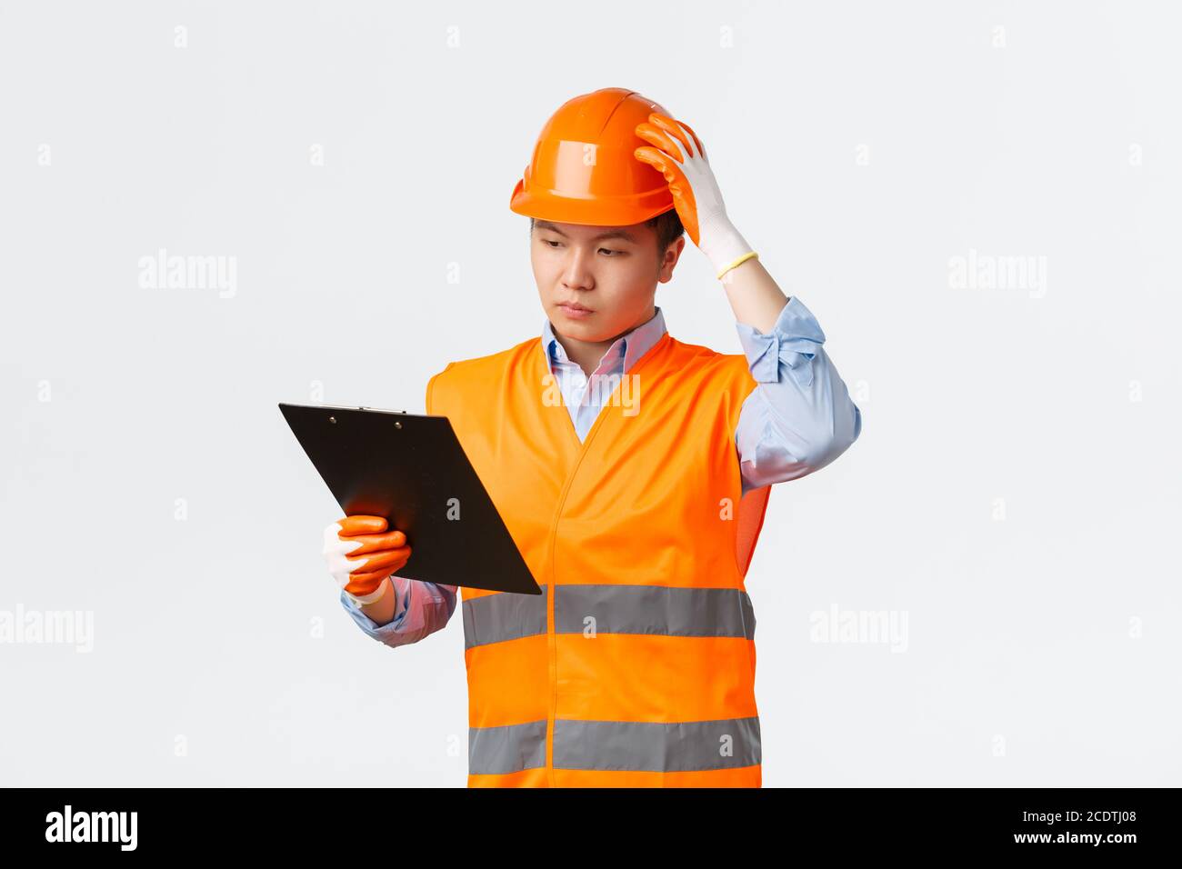 Building sector and industrial workers concept. Serious-looking puzzled ...