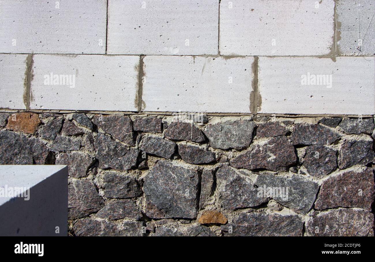 Stone foundation and aerated concrete wall, house construction ...