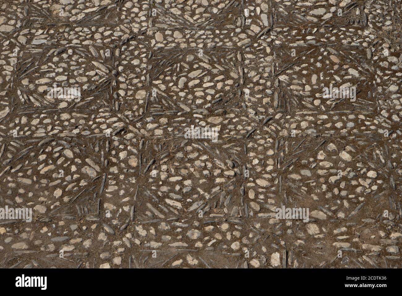 Patterns on a stone walking path at the Alhambra palace in Granada ...