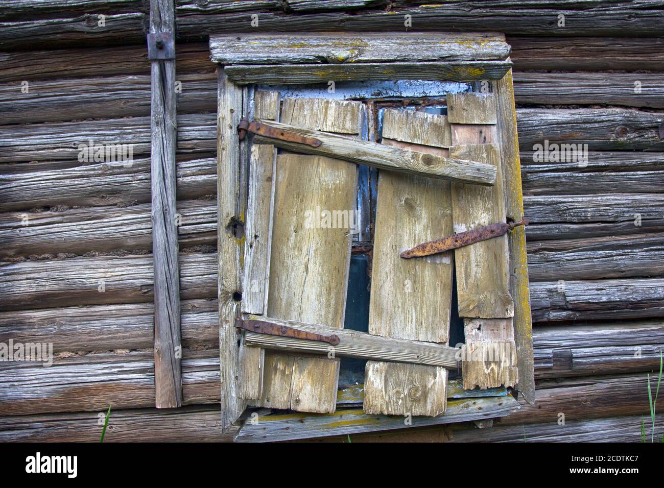 Window of wooden house closed with collapsed shutter Stock Photo - Alamy