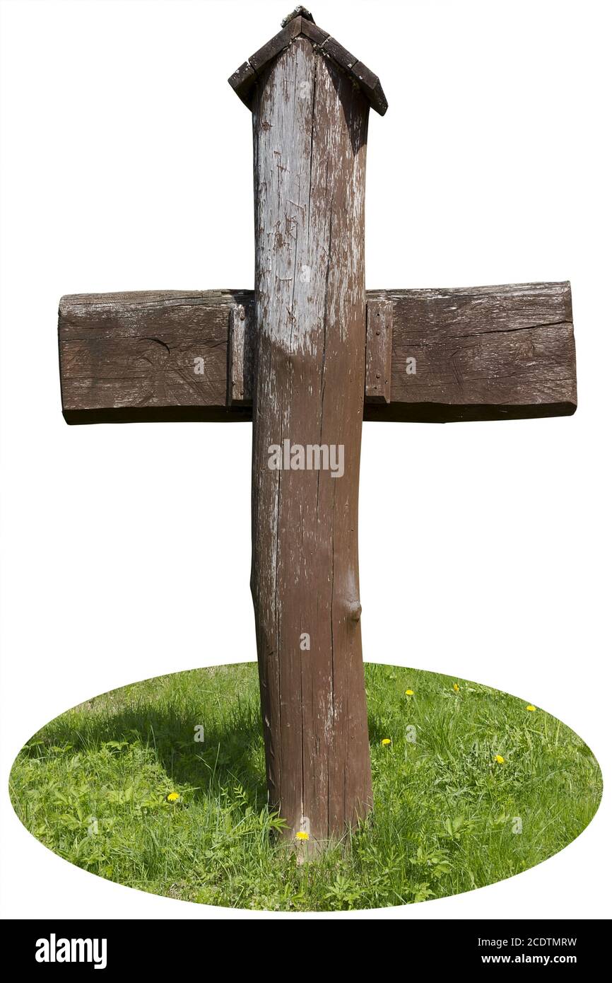The brown wooden cross from pine logs is on a forest glade ...