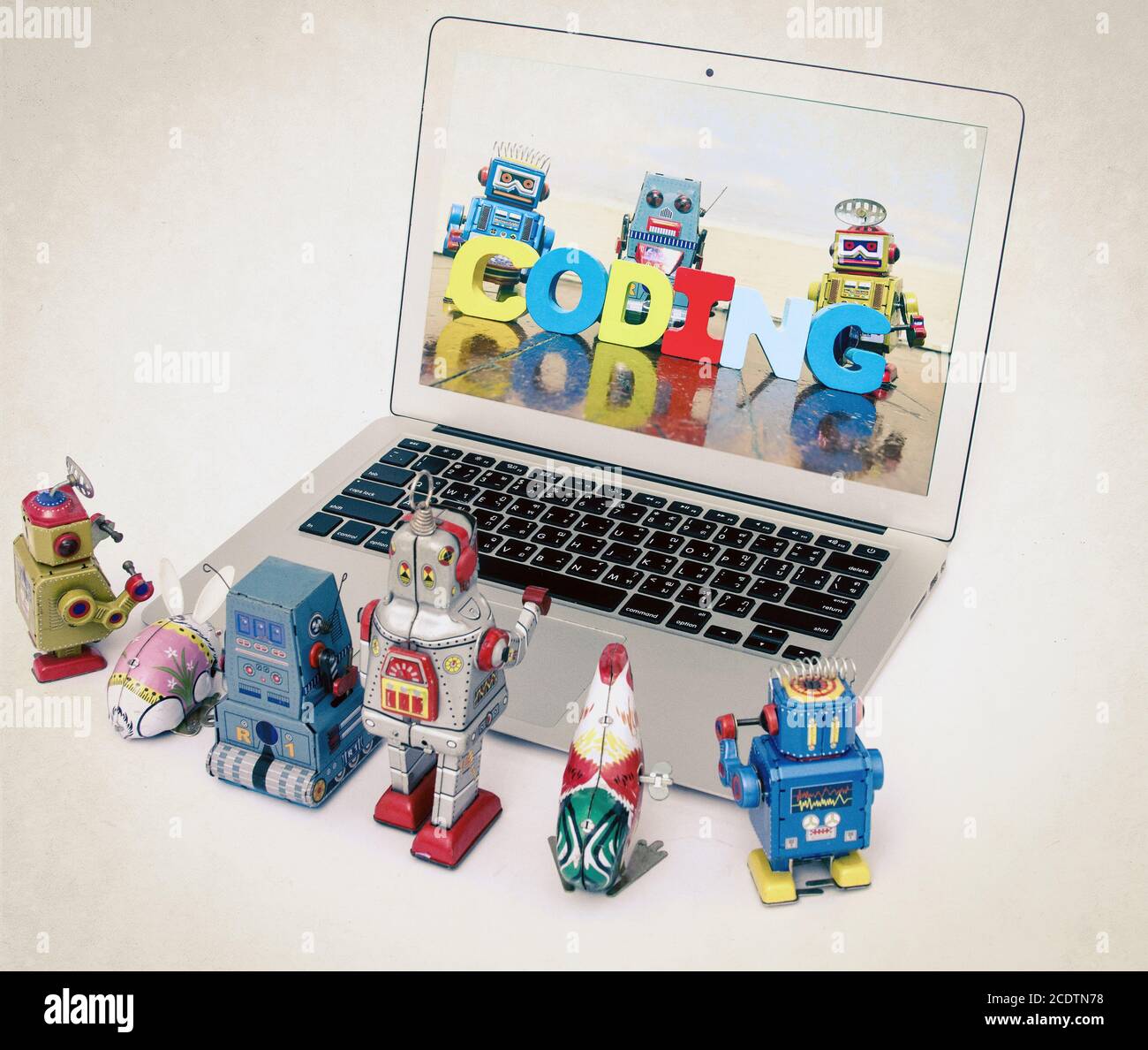 A team of robot toys learn coding Stock Photo - Alamy