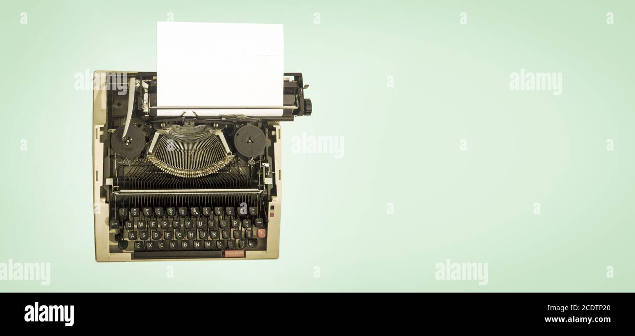 vintage mechanical typewriter, on a light green Stock Photo - Alamy