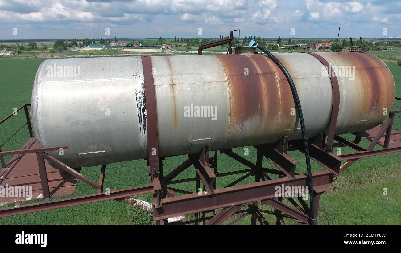 The water tower. An old rustic communal communication. The water tower ...
