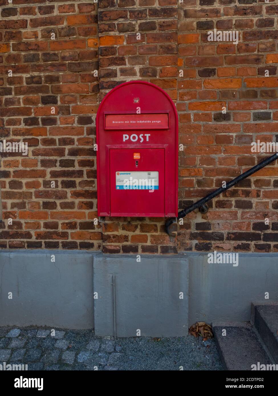 Red Vintage Mail Box hanging on a old terra cotta brick wall Stock ...