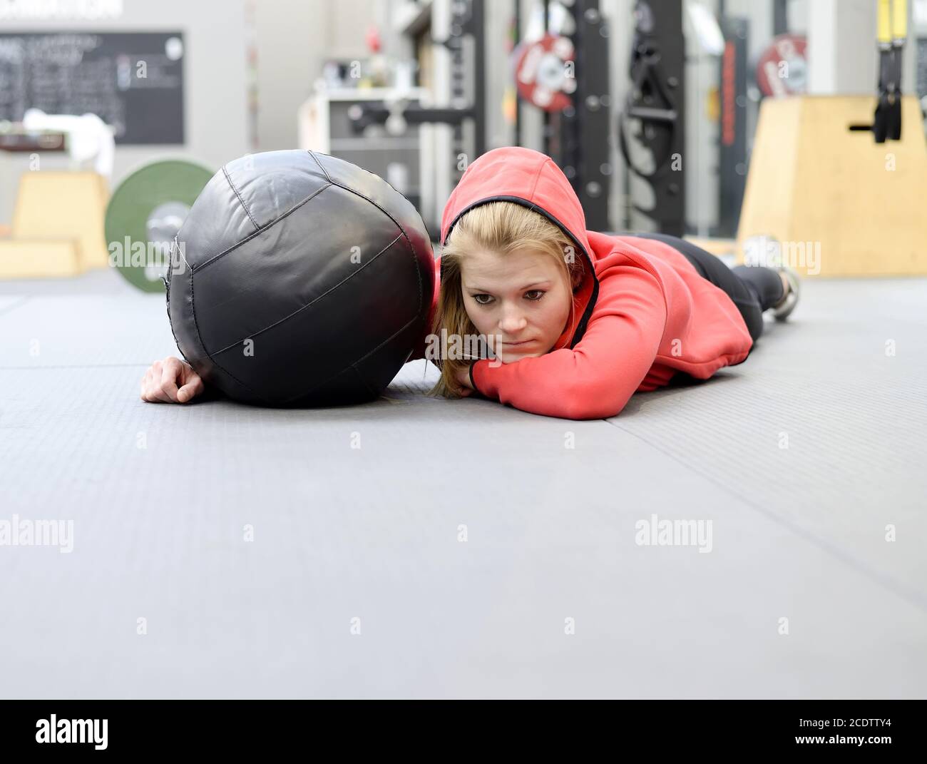 exhausted young woman in gym Stock Photo - Alamy