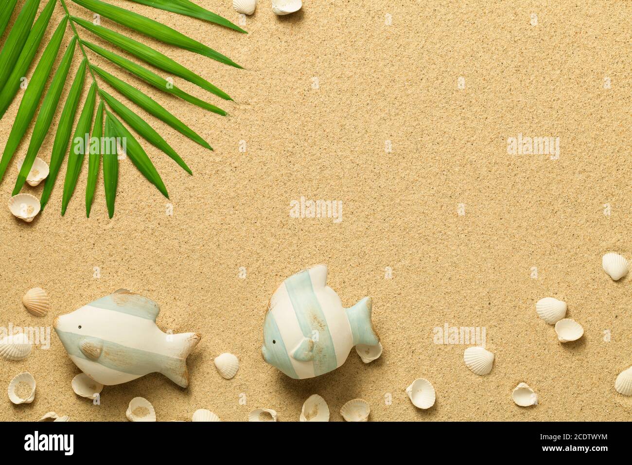 Summer Background with Green Palm Leaf, Fish and Shells Stock Photo - Alamy