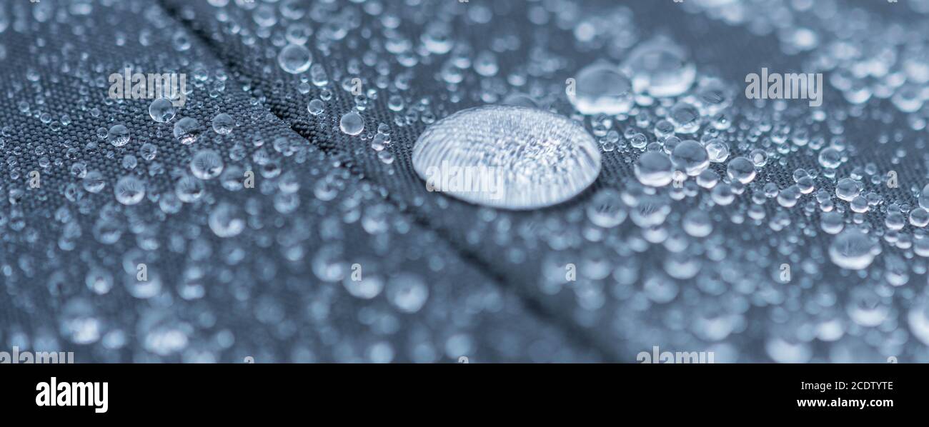 Closeup detailed view of raindrops on a fabric, a background Stock ...