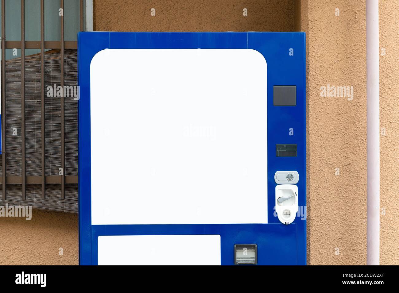 Empty white shelves of standard office vending machine Stock Photo - Alamy