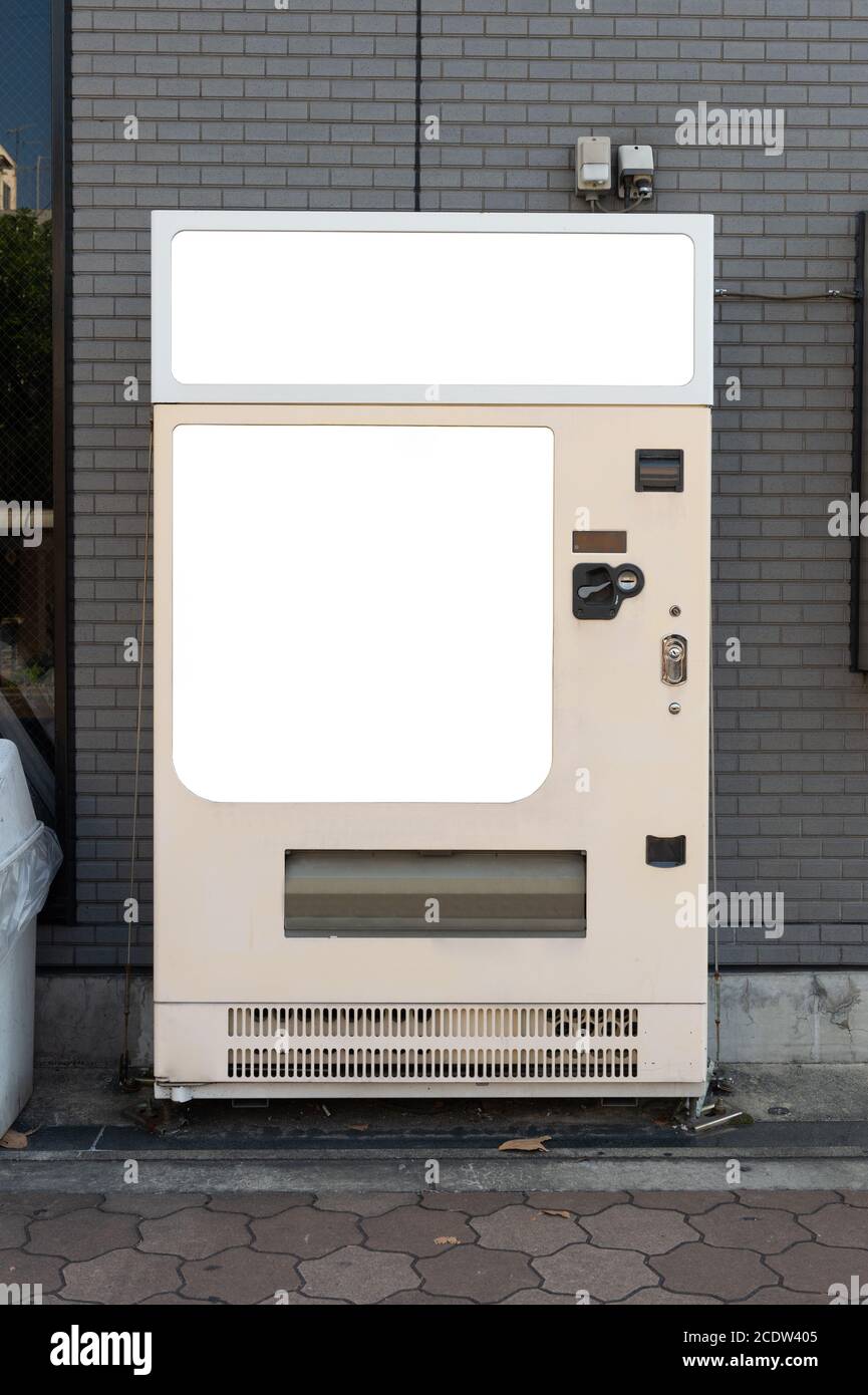 Empty white shelves of standard office vending machine Stock Photo - Alamy