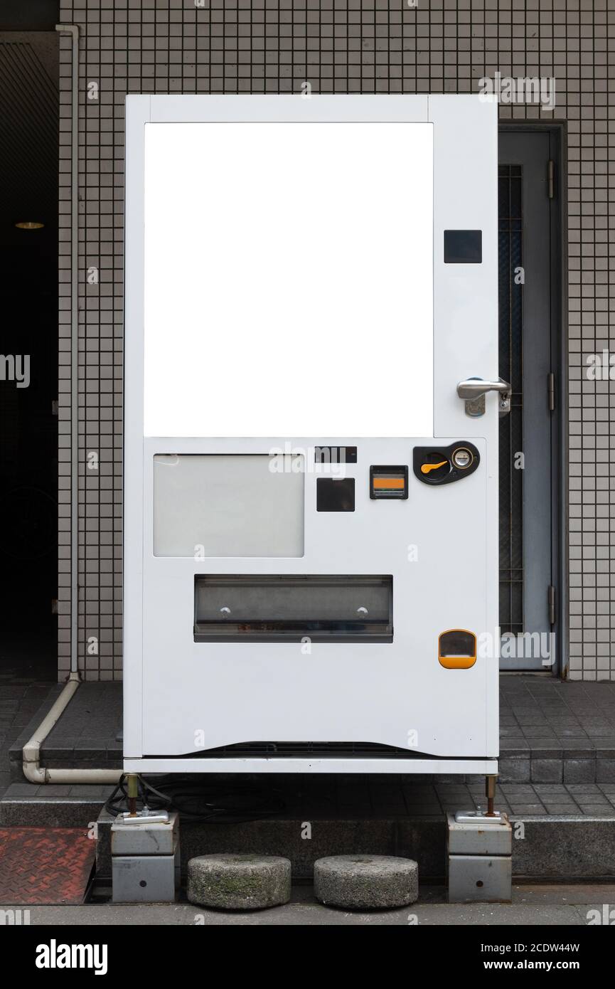 Empty white shelves of standard office vending machine Stock Photo - Alamy