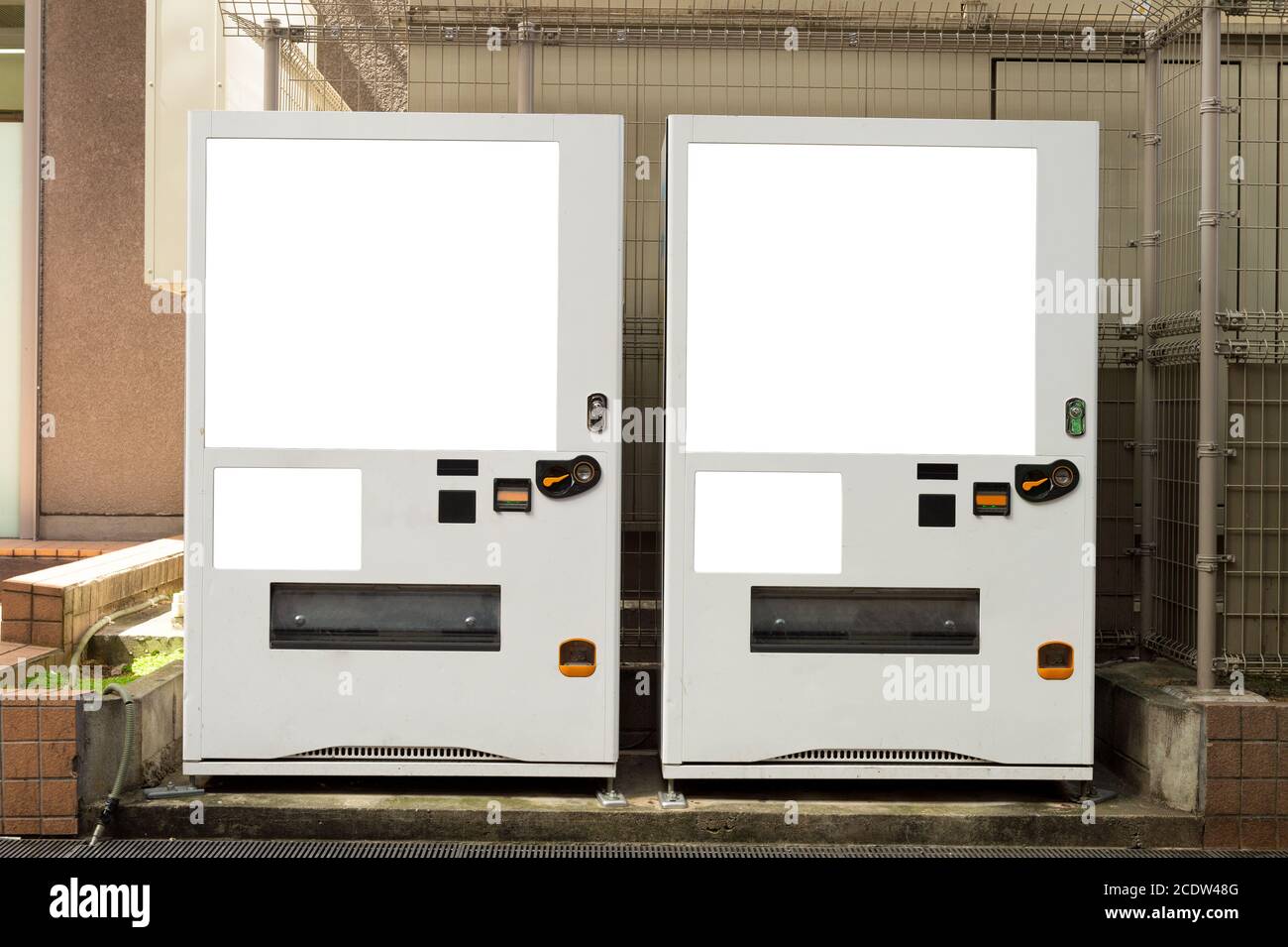 Empty white shelves of standard office vending machine Stock Photo - Alamy