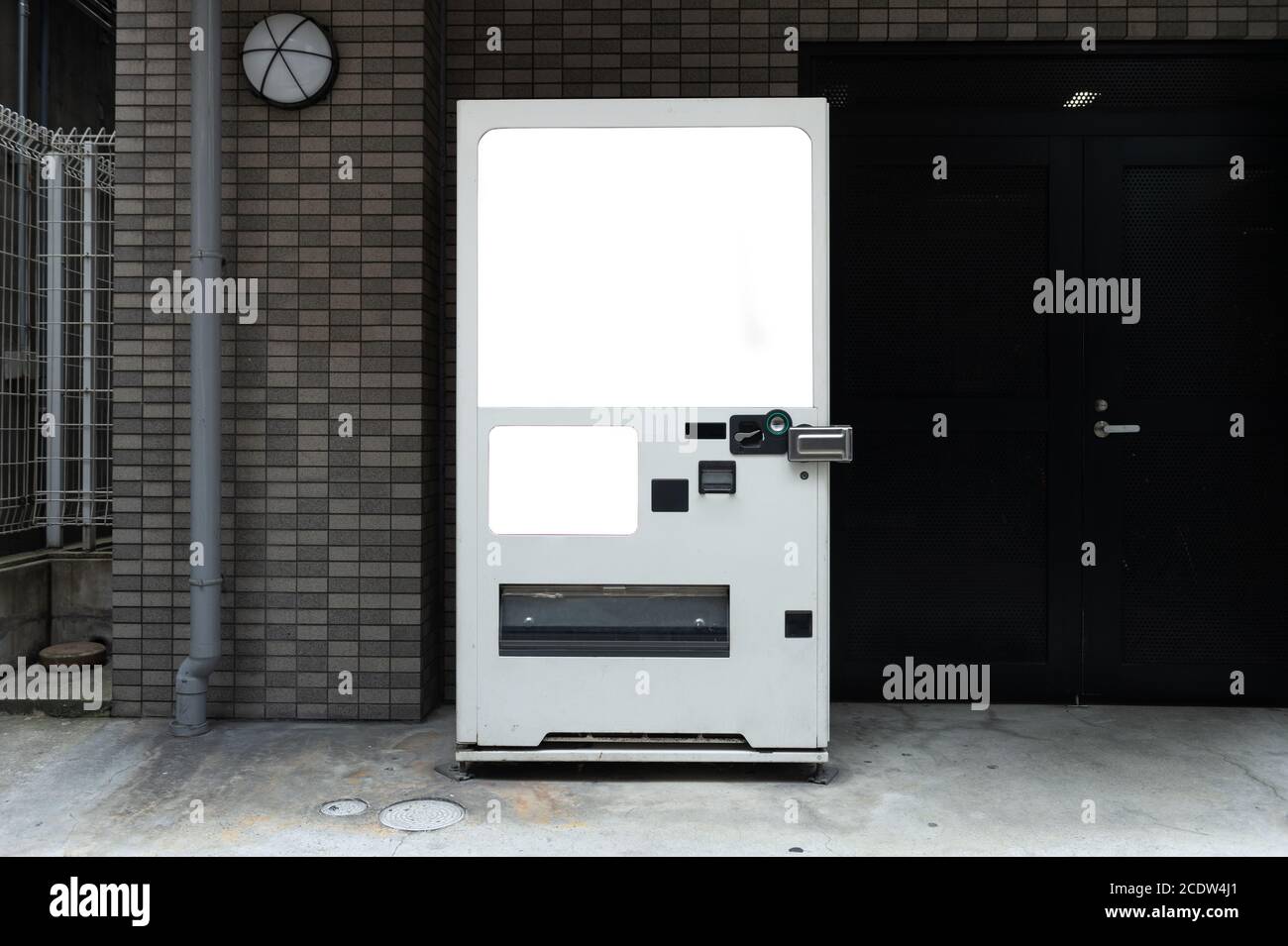 Empty white shelves of standard office vending machine Stock Photo - Alamy