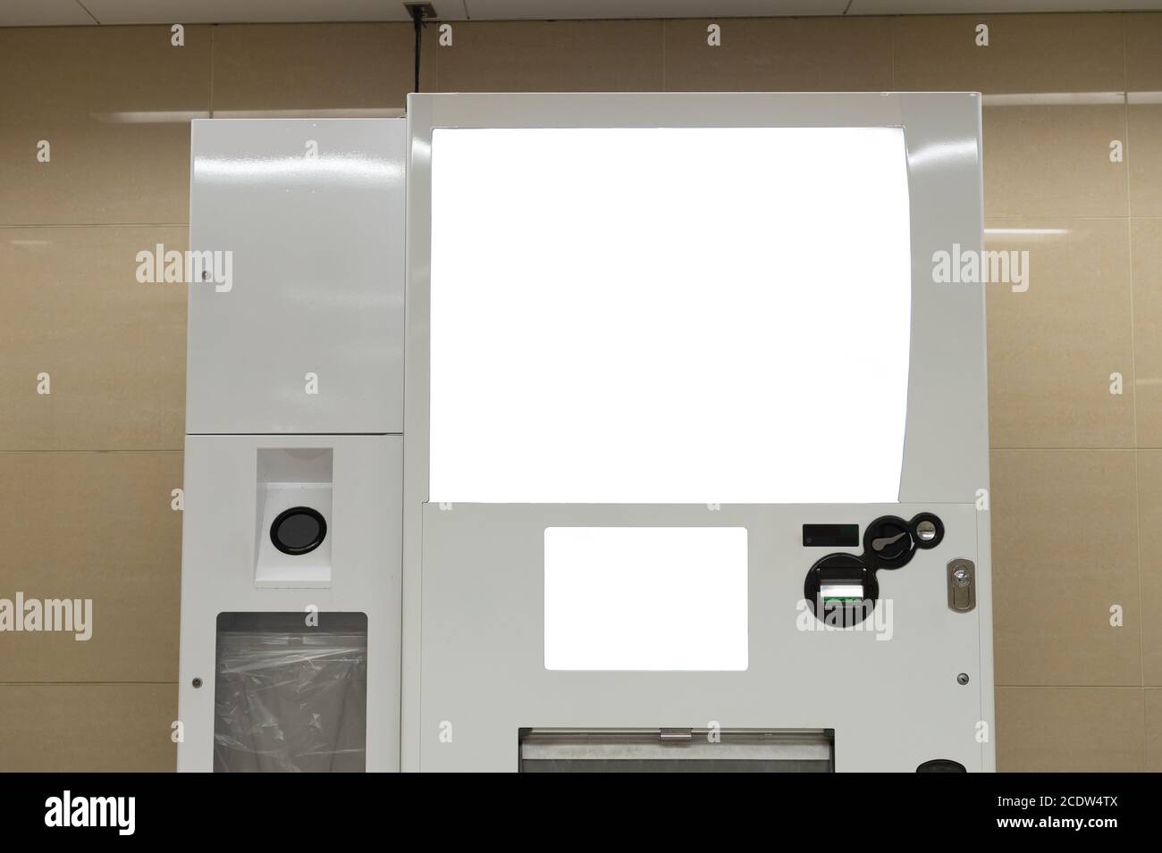Empty white shelves of standard office vending machine Stock Photo - Alamy