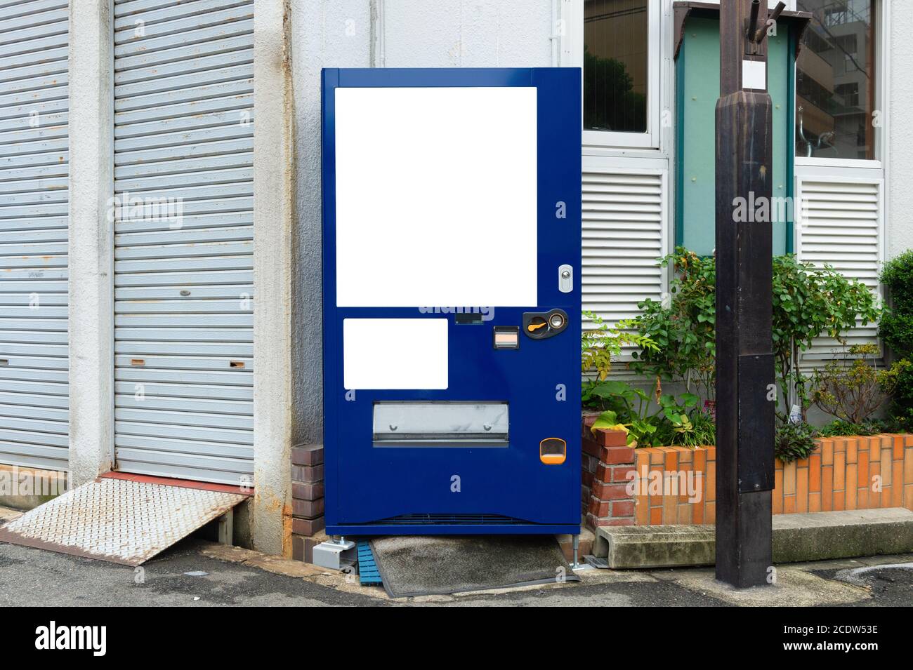 Empty white shelves of standard office vending machine Stock Photo - Alamy
