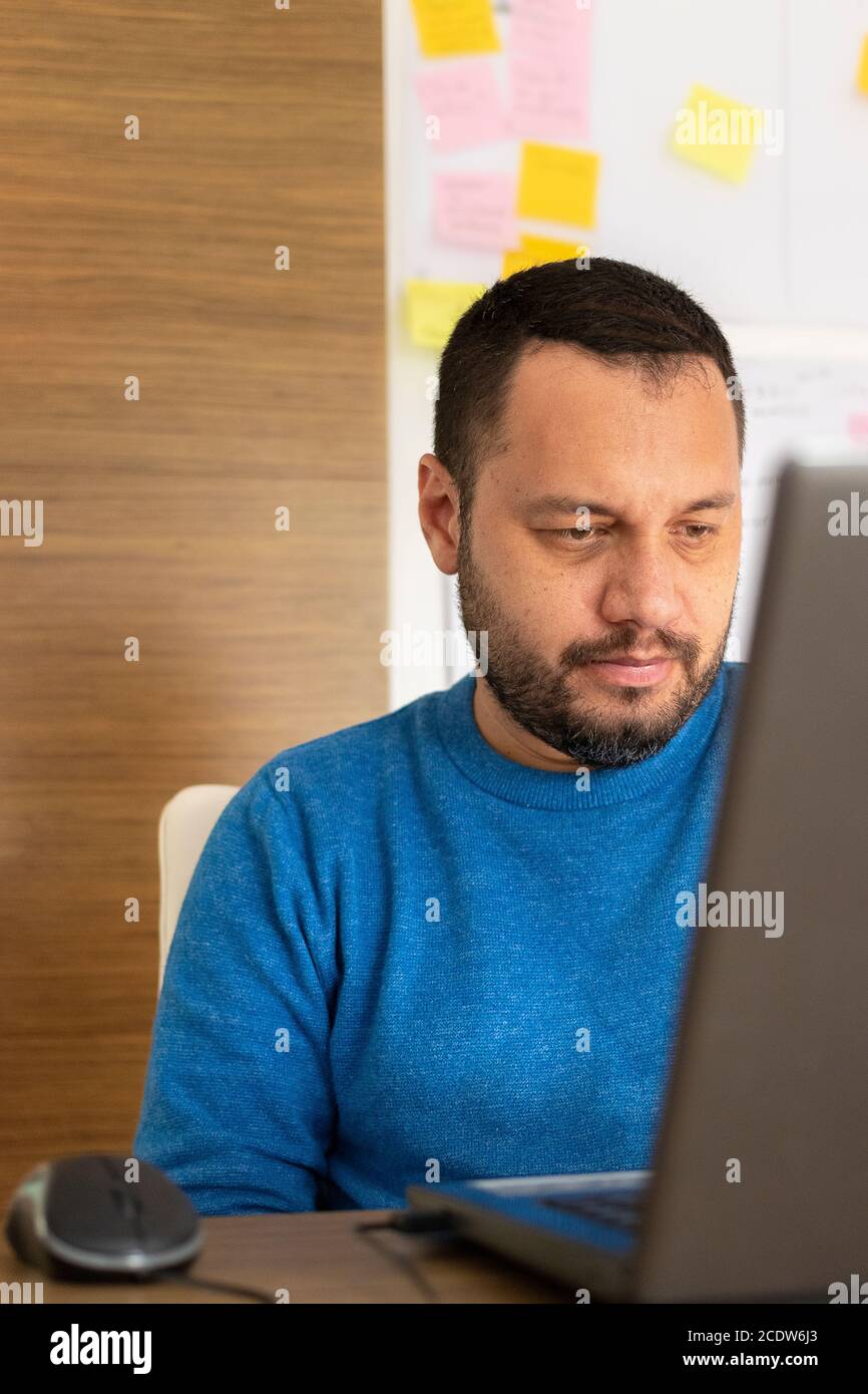 Young man working with his laptop Stock Photo - Alamy
