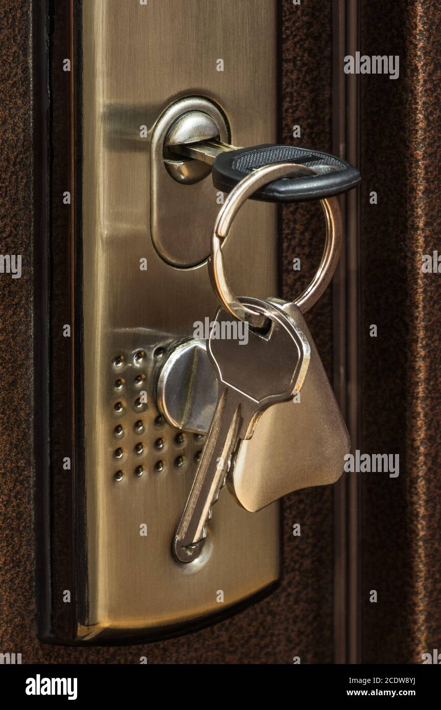 The key to the lock in the keyhole Stock Photo - Alamy